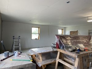 Paneling Primed, looks so big and open! – 8 O'Clock Ranch